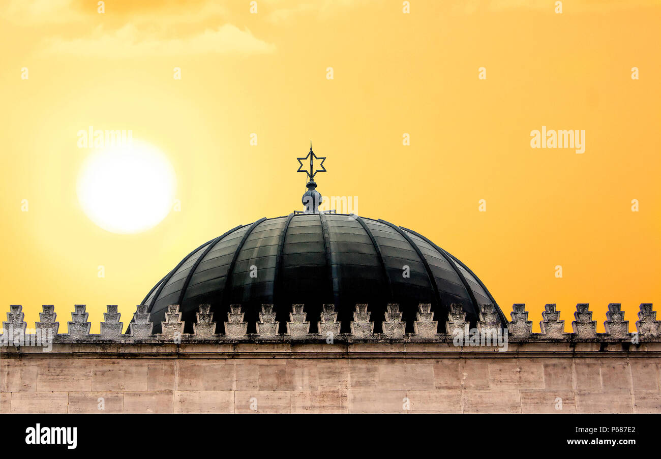 Dome of the synagogue with the sign of the star of David at sunset ...