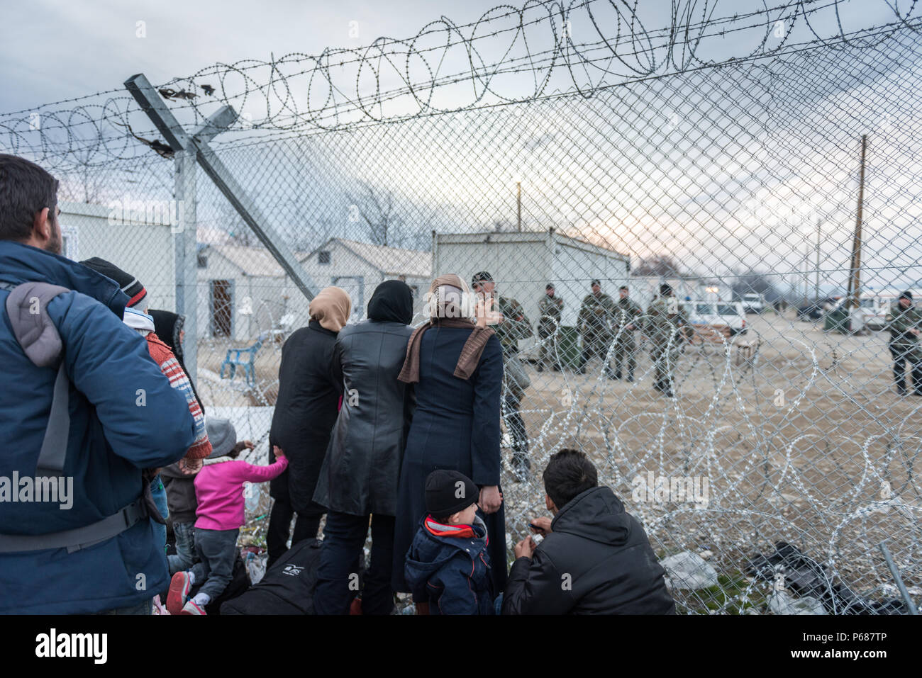 Barbed wire fence refugee woman hi-res stock photography and images - Alamy