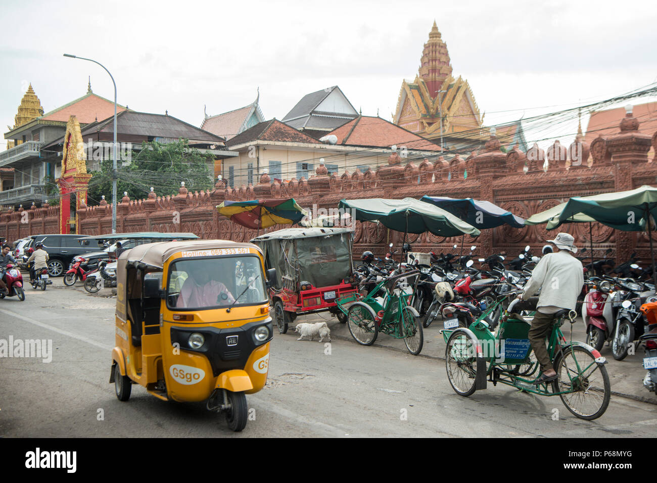 traffic at a street corner in the city of Phnom Penh of Cambodia. Cambodia, Phnom Penh, November ...