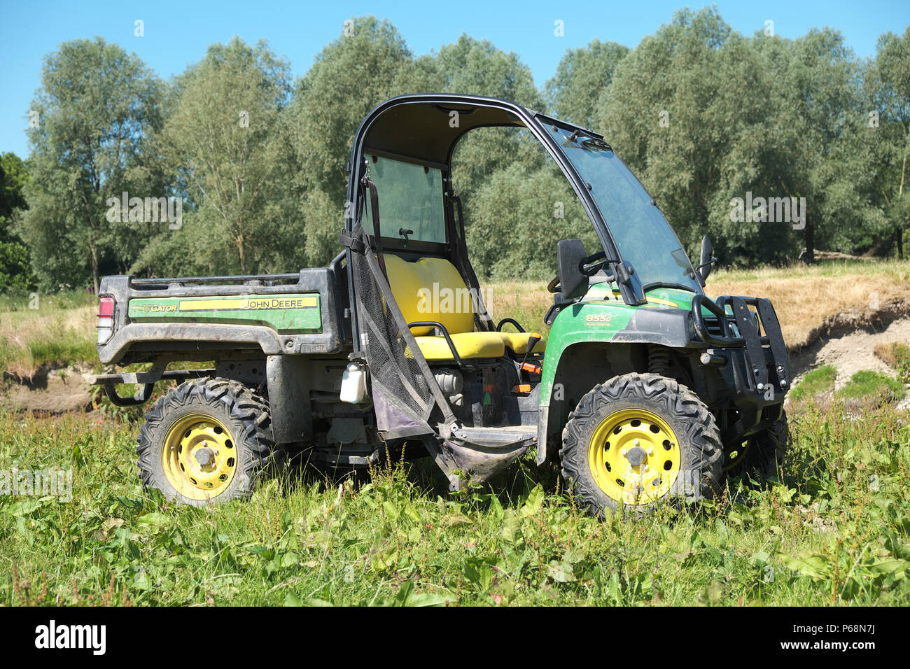 John Deere 855 Gator 4WD utility vehicle in a rural field in England UK ...