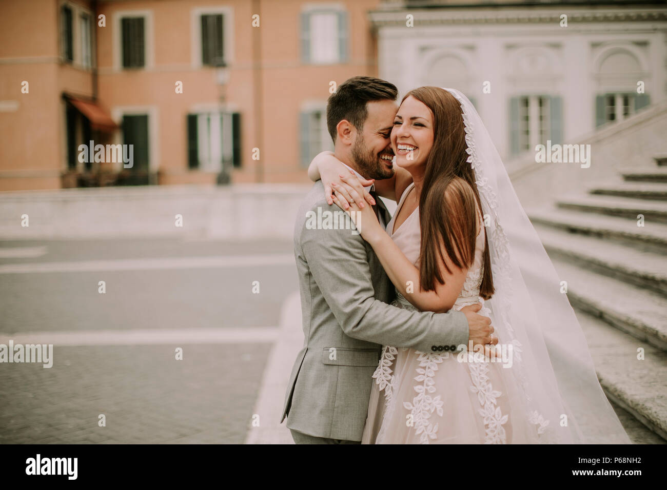 Young wedding couple on Spanish stairs in Rome, Italy Stock Photo - Alamy