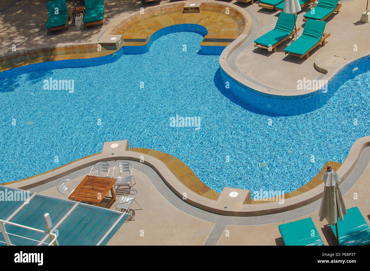 Swimming pool beautiful in tropical resort Stock Photo - Alamy