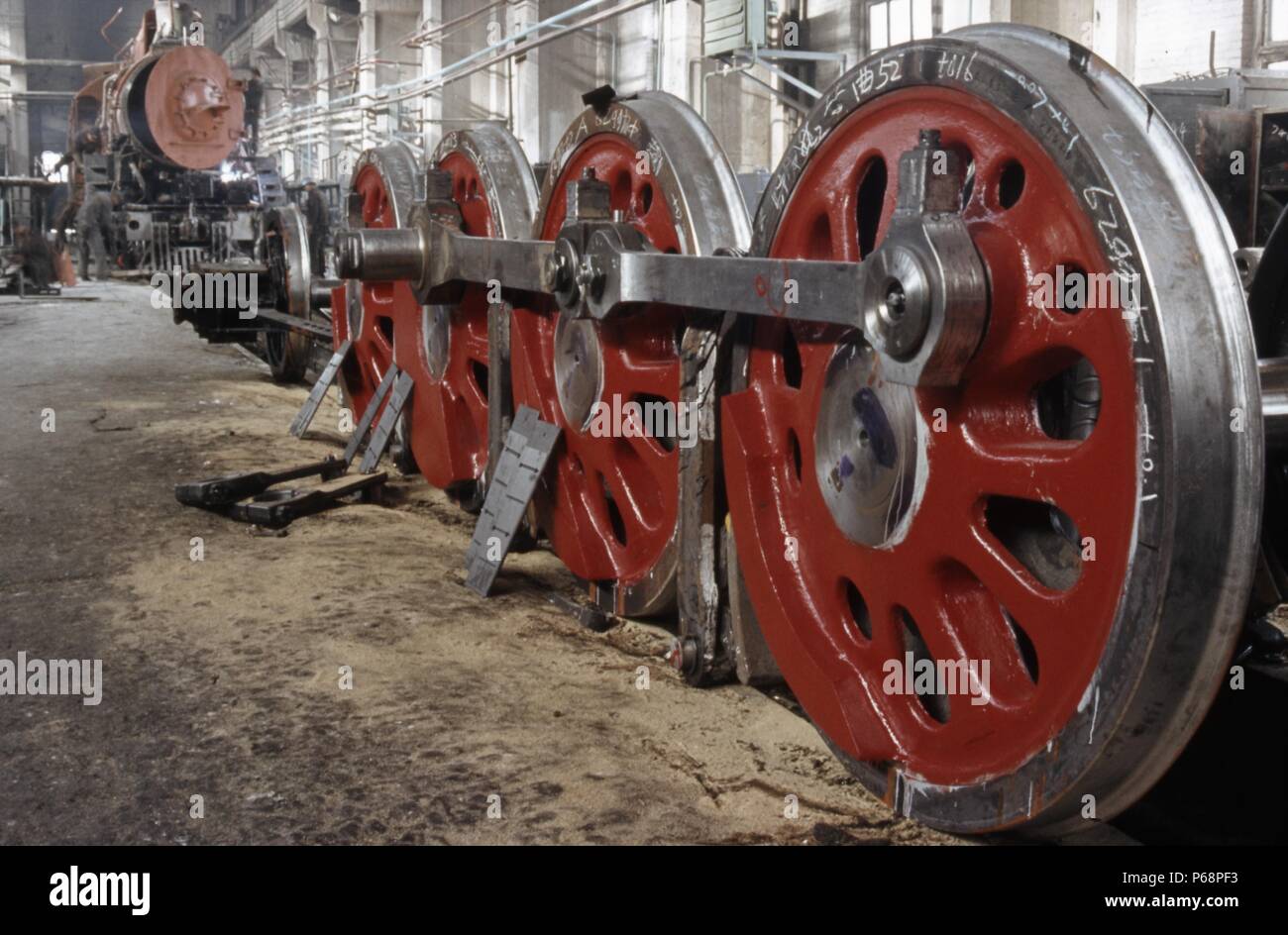 The wheels of a new JS 2-8-2 wait to be rolled into position at Datong ...