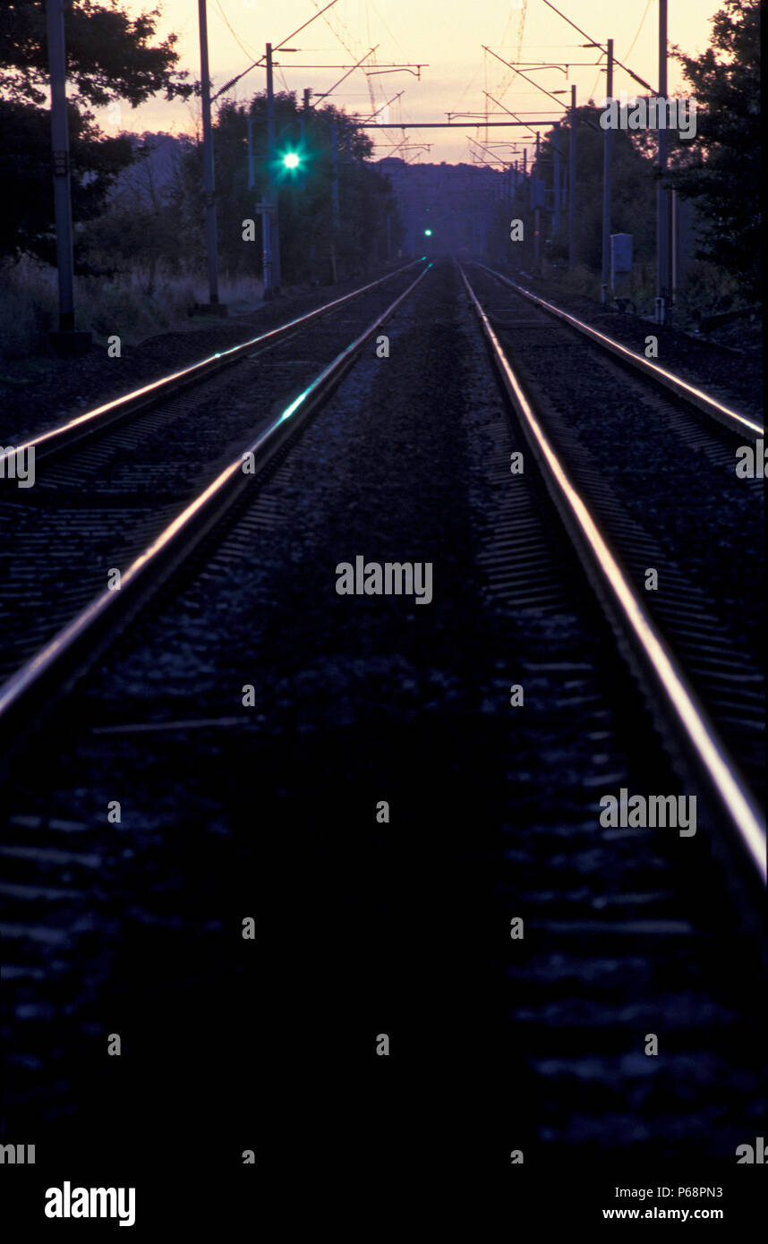 Track and green aspect signal at sunset. C 2000 Stock Photo - Alamy