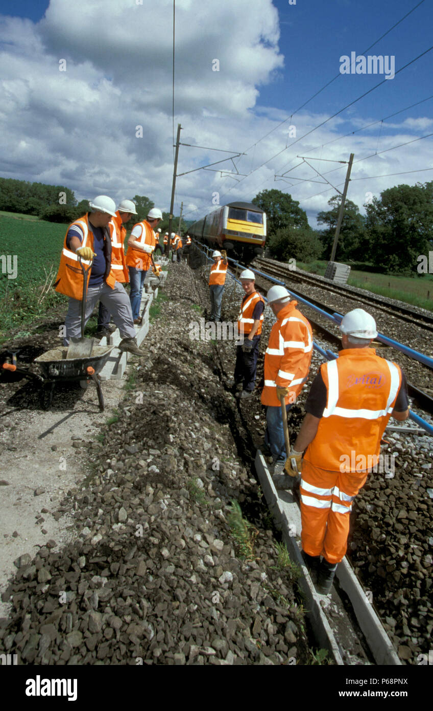 Track workers install cable ducting on West Coast Main Line as a Virgin ...