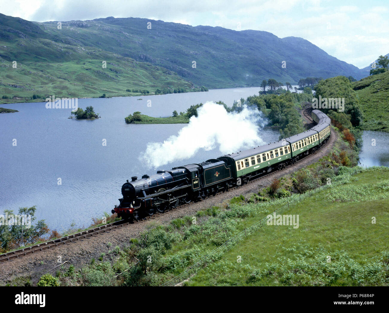 West Highlander. No.44767 George Stephenson skirts Lock Eilt with the ...