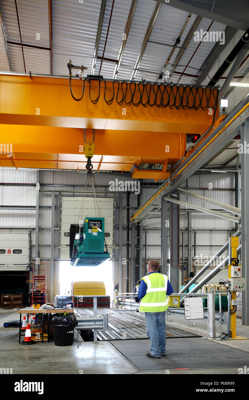 Gantry crane loading in an industrial warehouse Stock Photo - Alamy