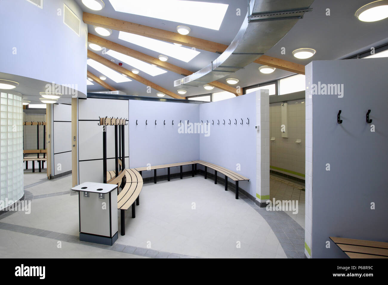 A section of a semi circular changing room in a London sports pavilion ...