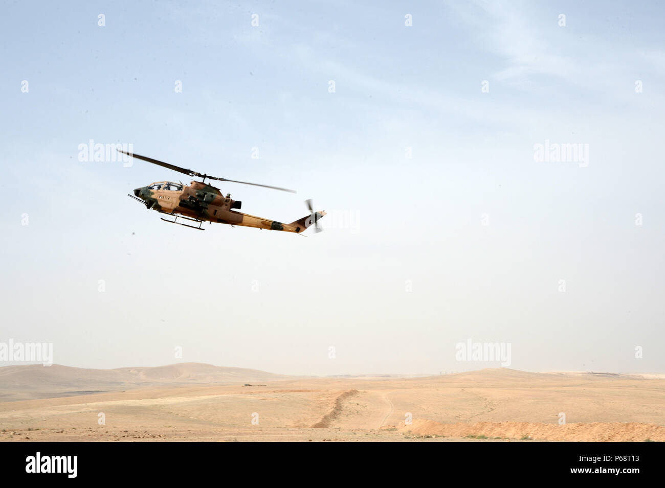 A Jordanian Armed Forces Cobra gunship provides air support during ...