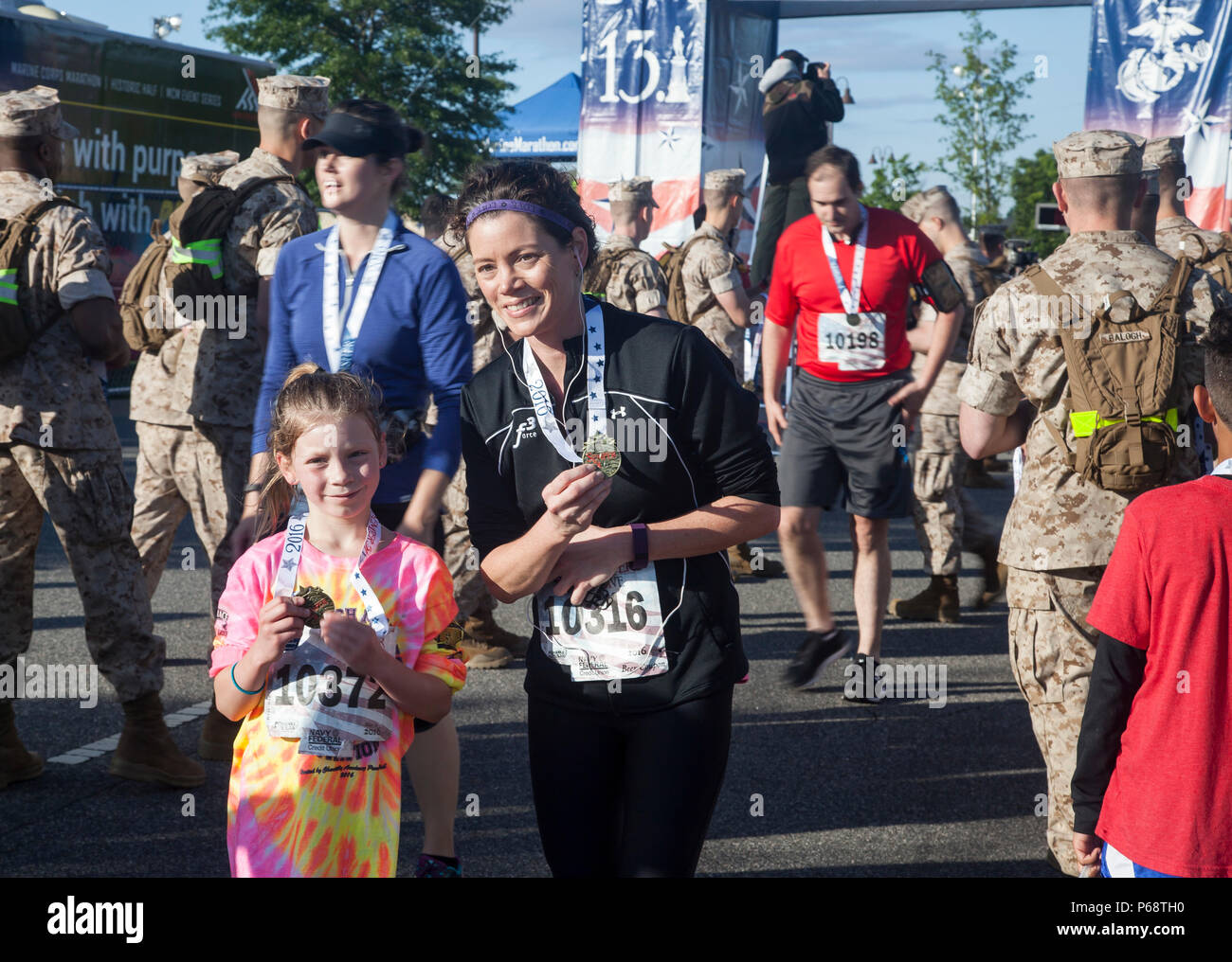 Jennifer (right) and Ava (left) Lengle display their medals after ...