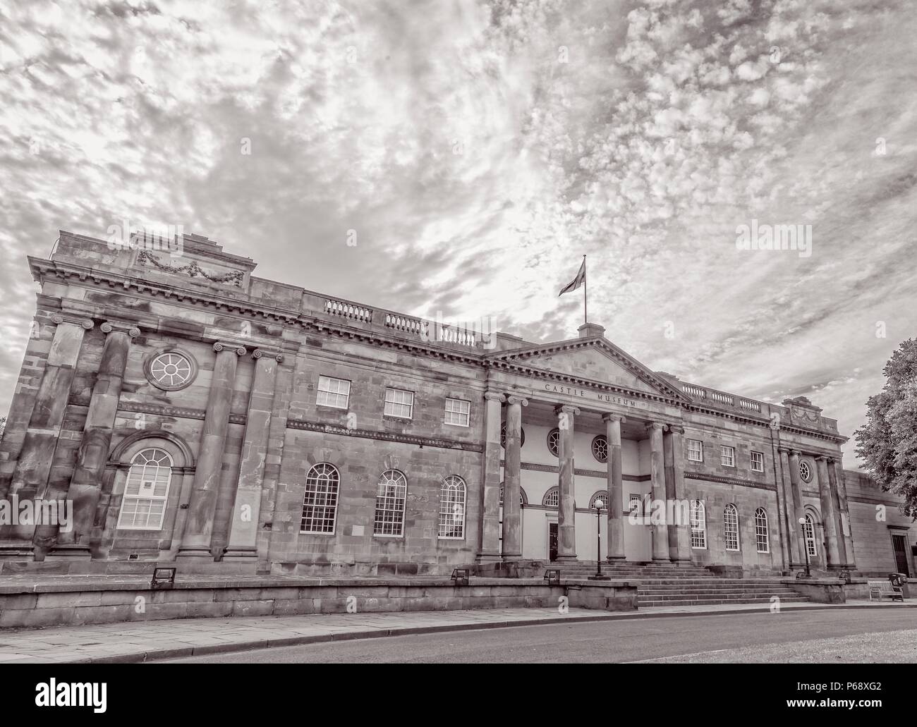 An 18th Century building made of stone with carvings and tall columns ...