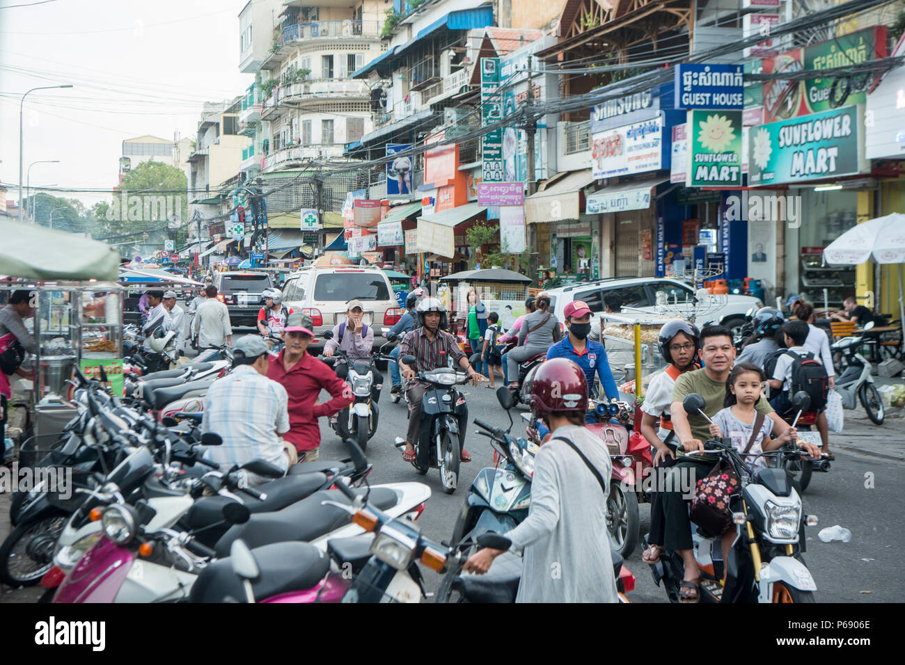 Street scene on a road in the city of Phnom Penh of Cambodia. Cambodia, Phnom Penh, November ...