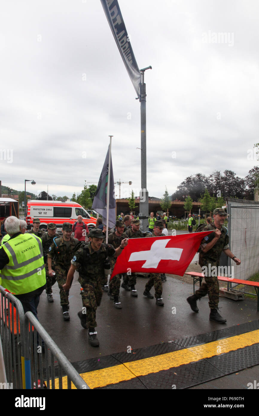 Swiss military members cross the finishline during the 49th Annual ...