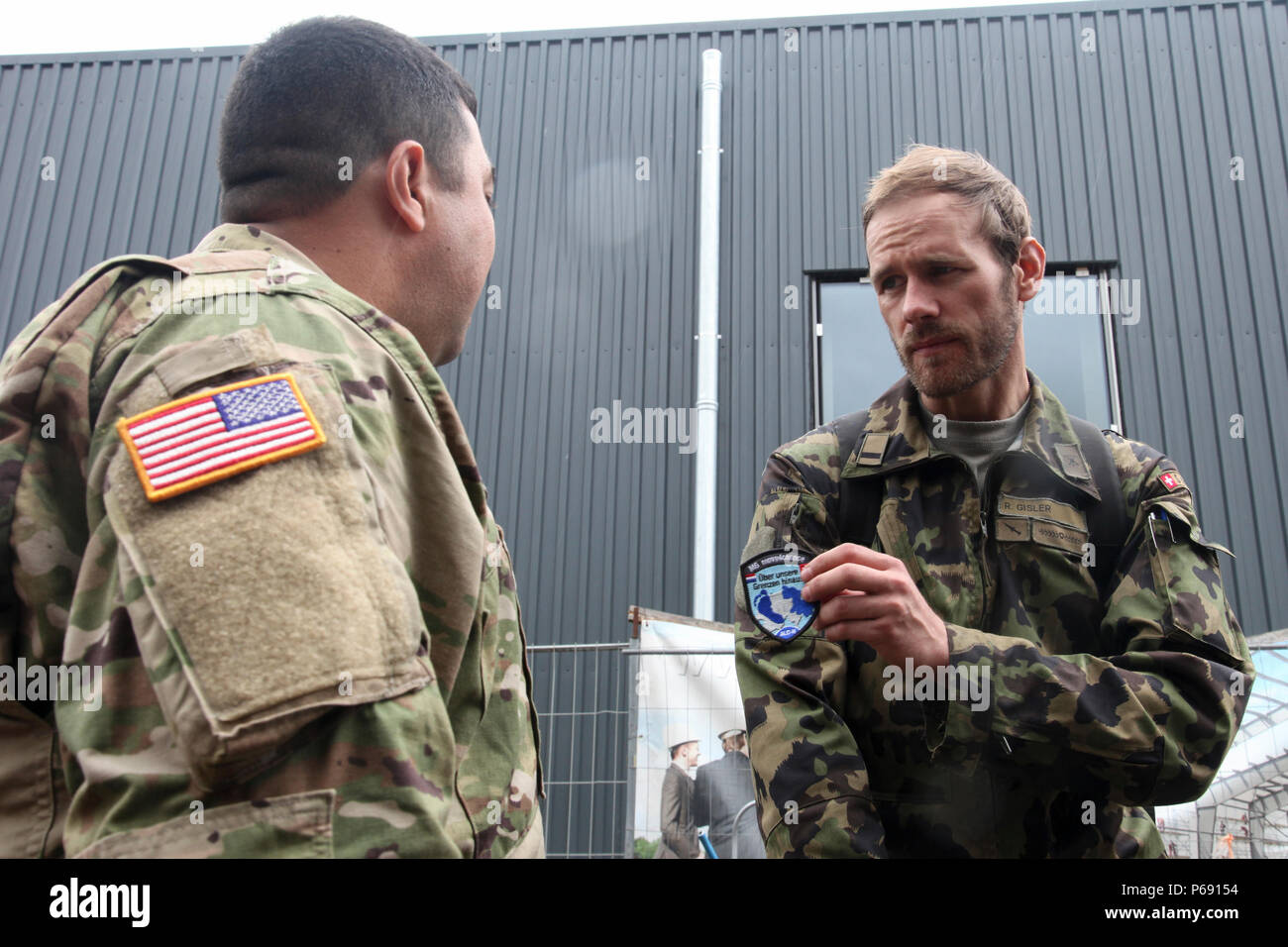 Sgt. Sergio Villafane interacts with Swiss military members during the ...