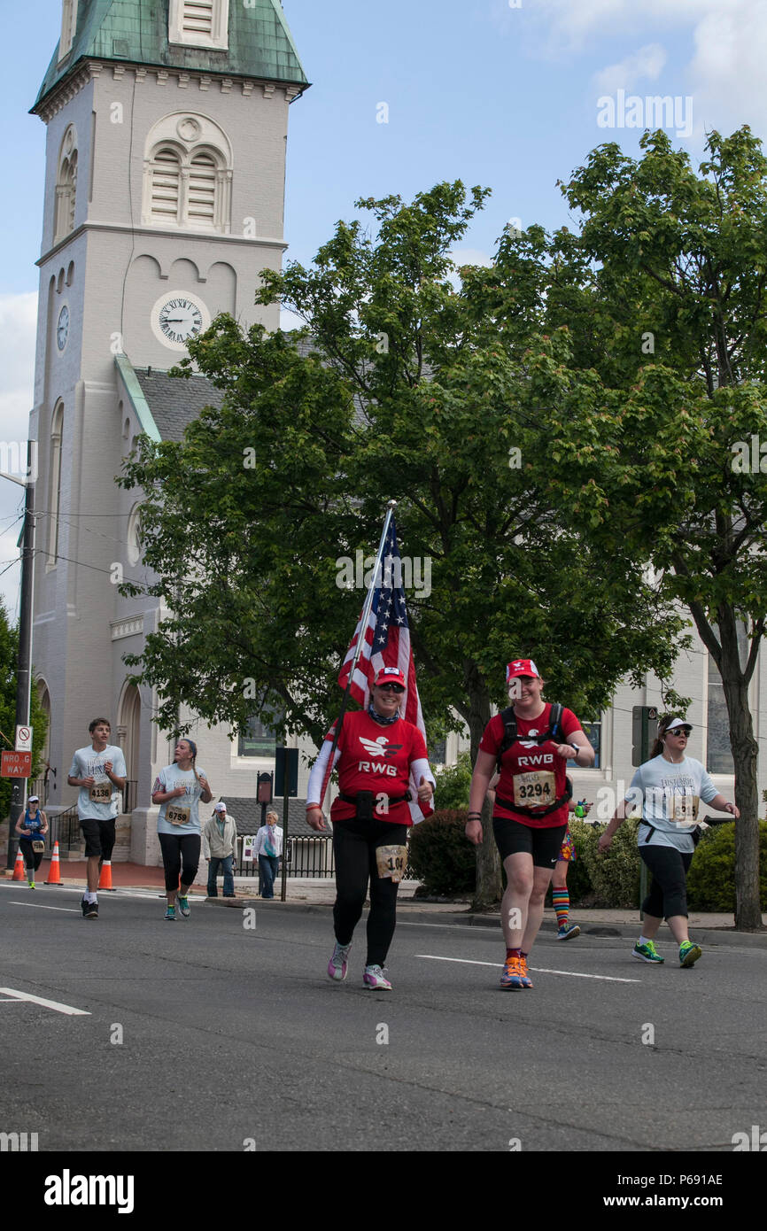 Donna Moore, left, and Mandy McGee, right, run down Princess Anne ...