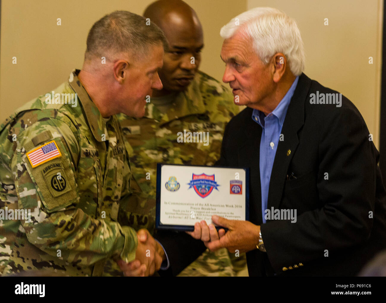 Chaplain (Col. Ret.) Alvin "Sonny" Moore III is presented with a token ...