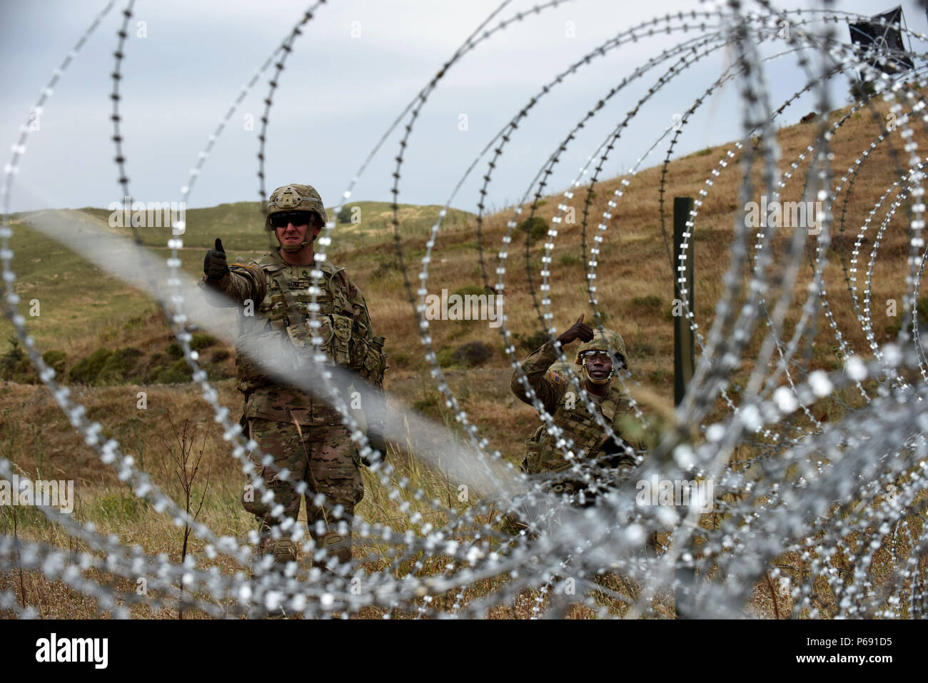 (Left to right) U.S. Army Staff Sgt. Robert Grissum, a squad leader ...