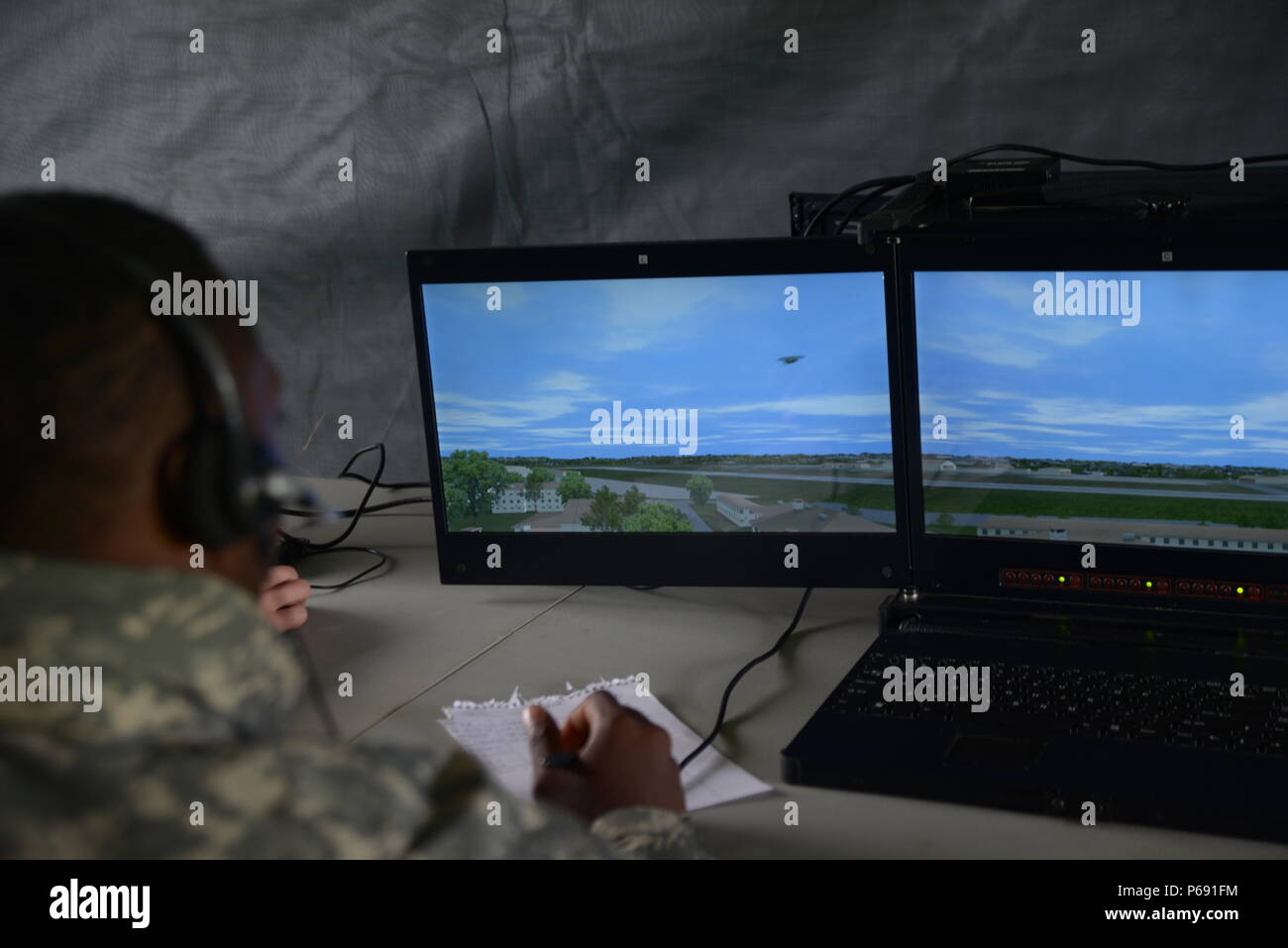 U.S. Army Spc. David Meek, an air traffic controller assigned to the ...