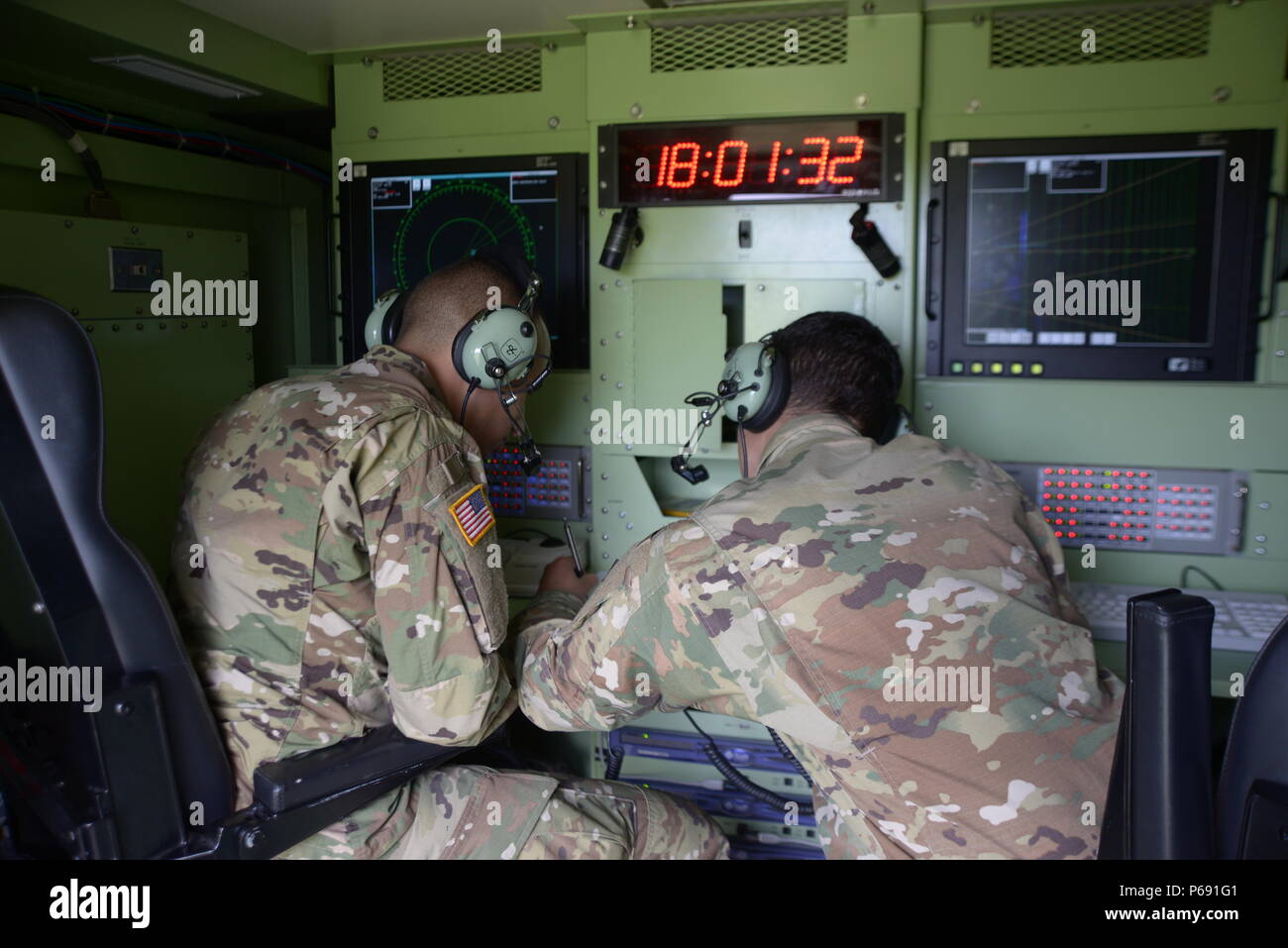U.S. Army Spc. Javier Steele (left), a ground control approach operator ...