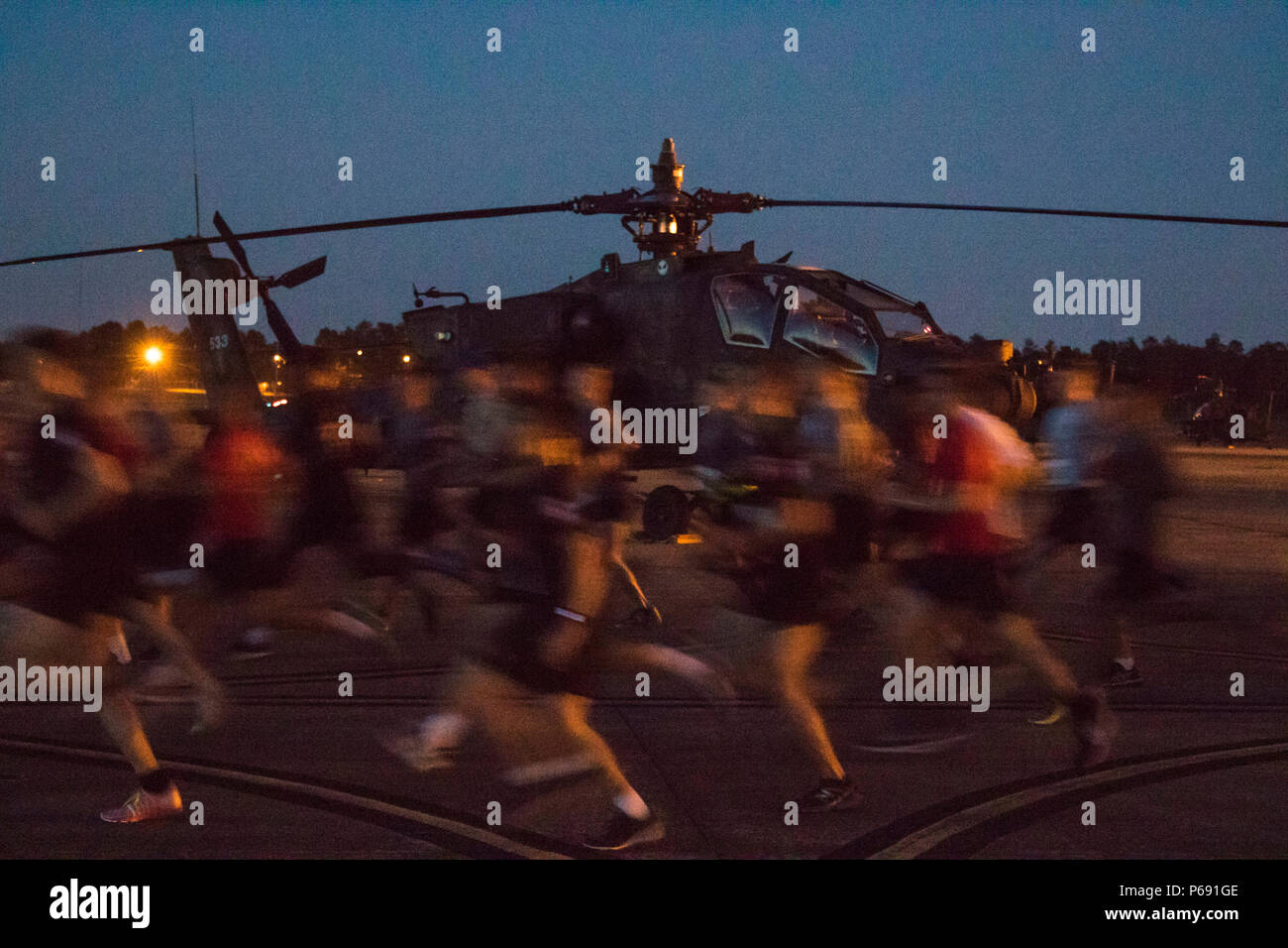 Runners in the 82nd Airborne Division 10-miler navigate the course on ...