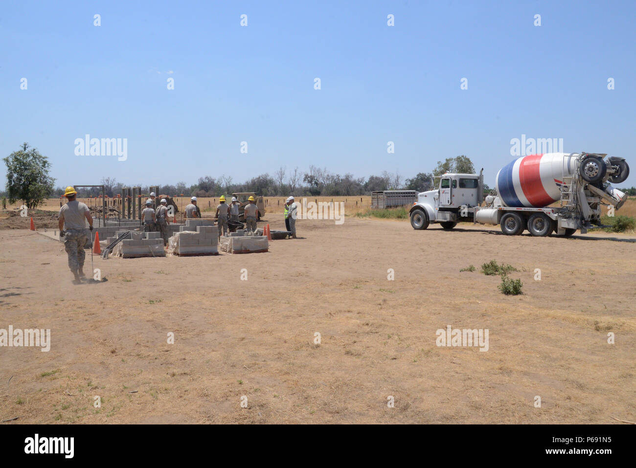 Soldiers of the 672nd Engineer Company construct a restroom in the ...