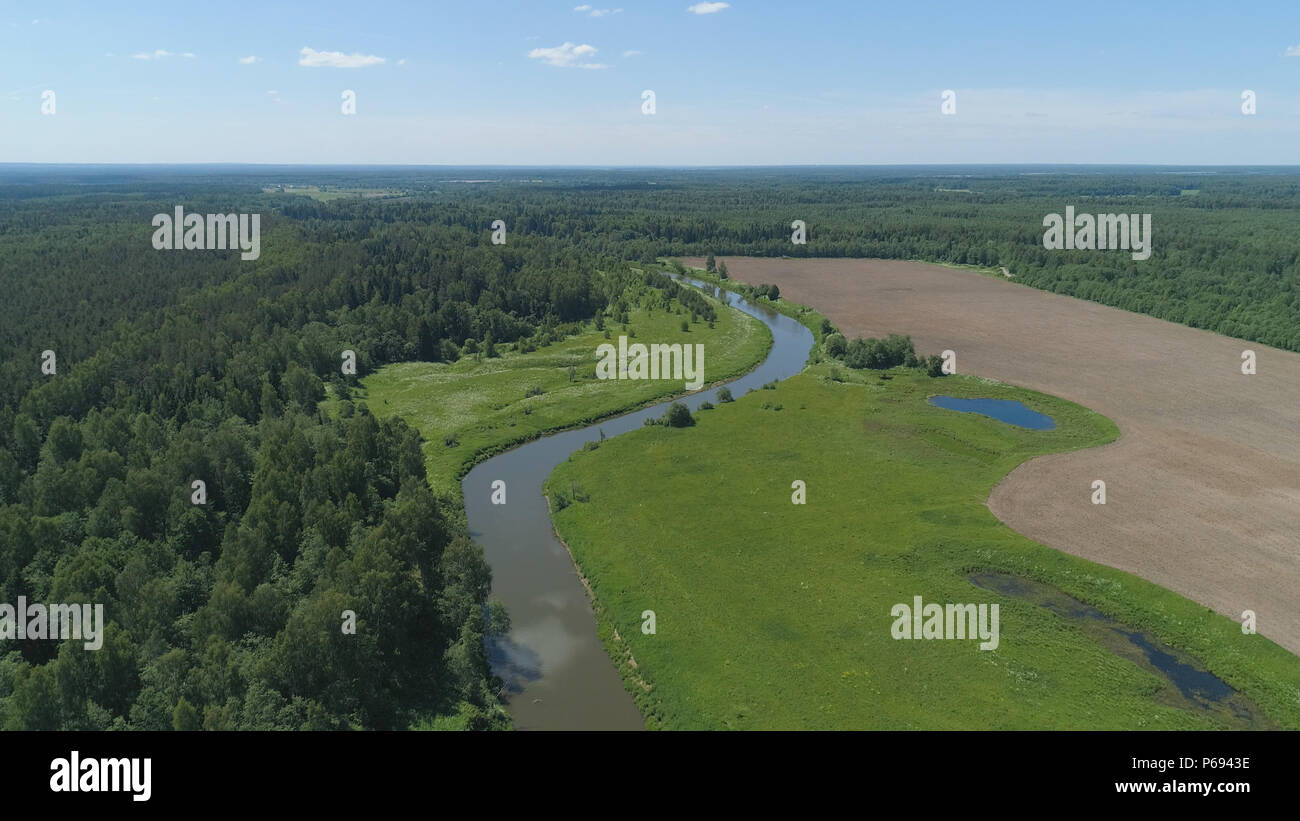 Aerial view summer landscape, river among trees, farmlands. Countryside ...