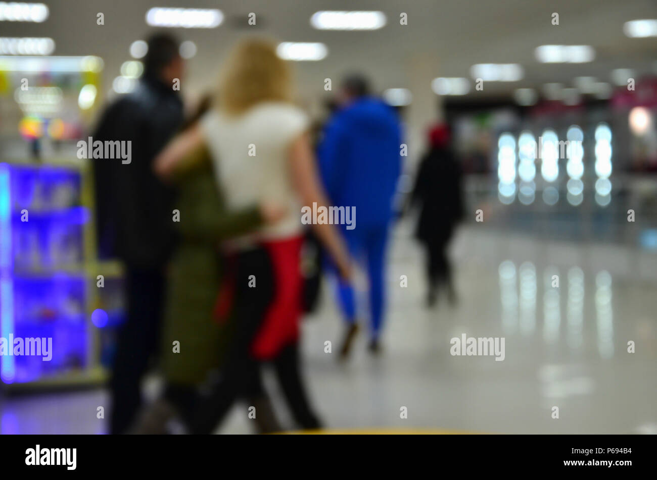 Defocused image of the interior spacious trading hall with a mass of ...
