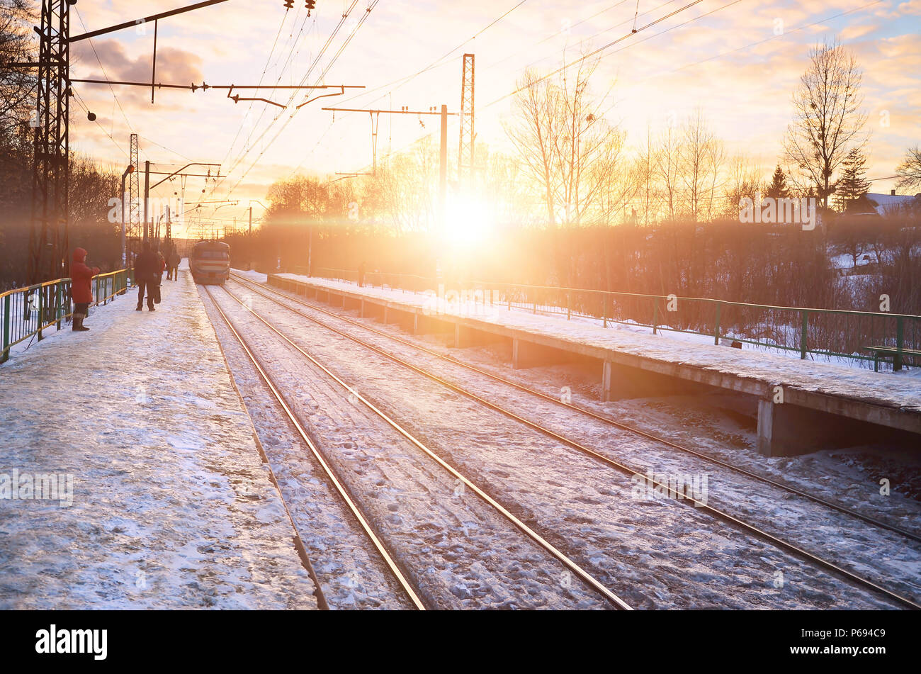 Photo of bright and beautiful sunset on a cloudy sky in cold winter ...