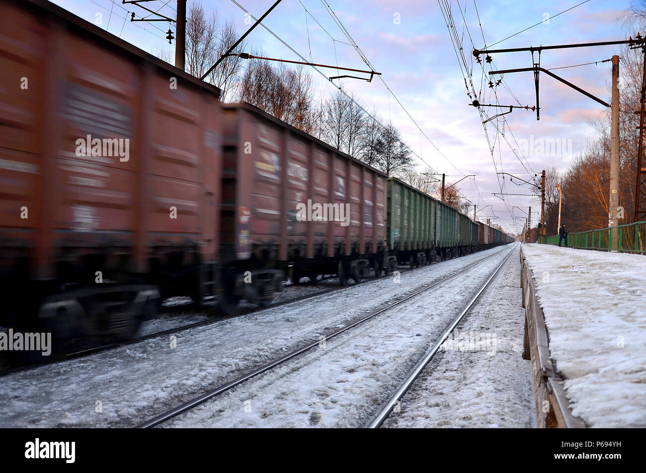 Photo of bright and beautiful sunset on a cloudy sky in cold winter ...