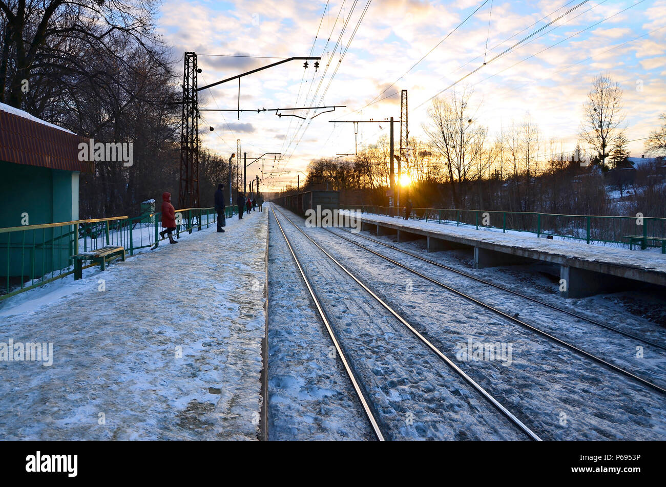 Photo of bright and beautiful sunset on a cloudy sky in cold winter ...