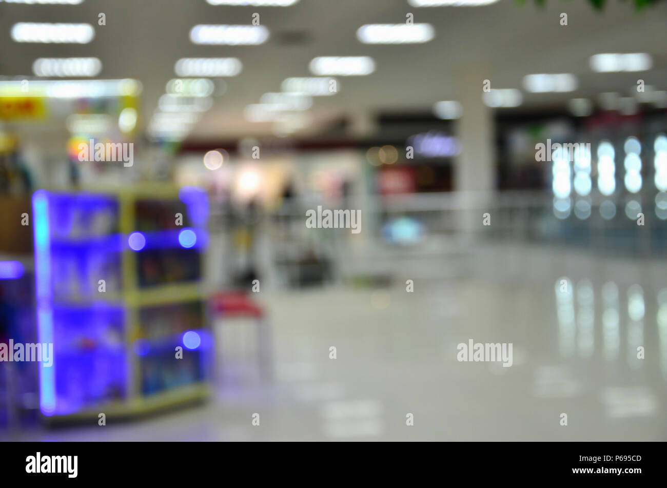 Blurred image of interior shopping mall or supermarket with bokeh ...