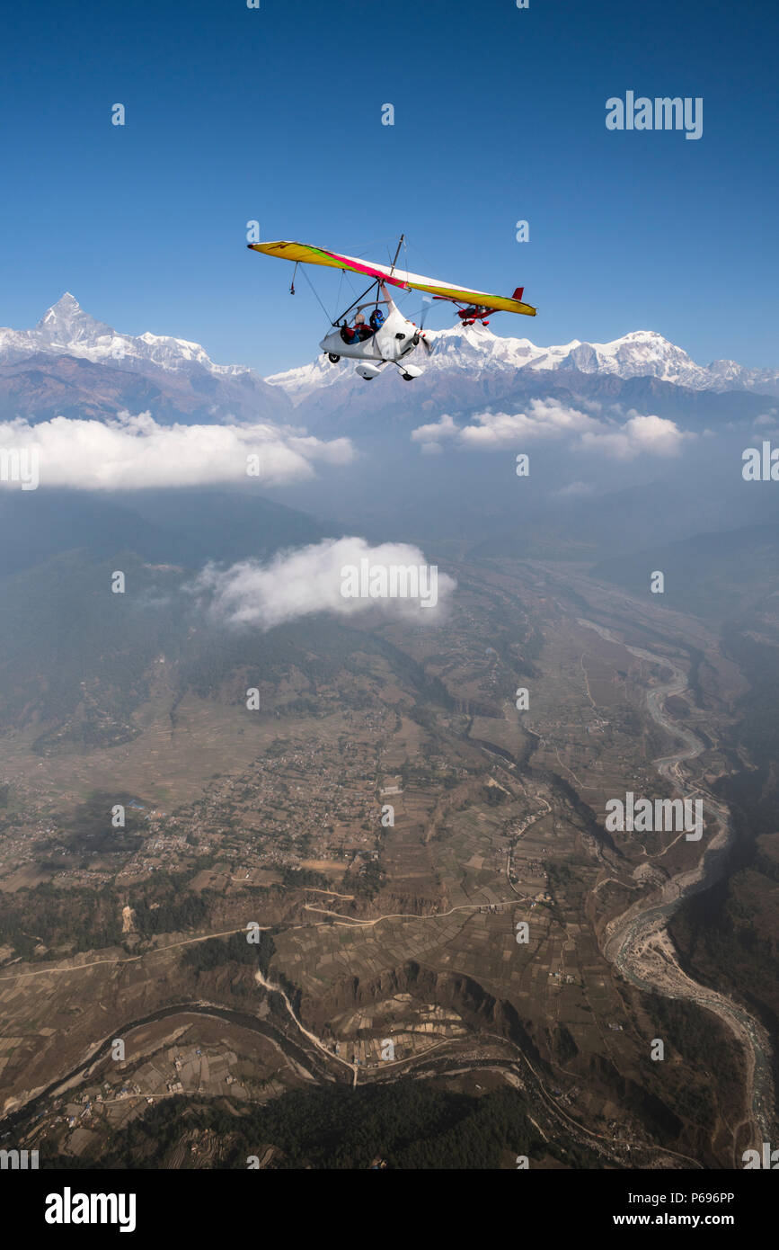 Ultralight plane and trike fly over Pokhara and Annapurna region in ...