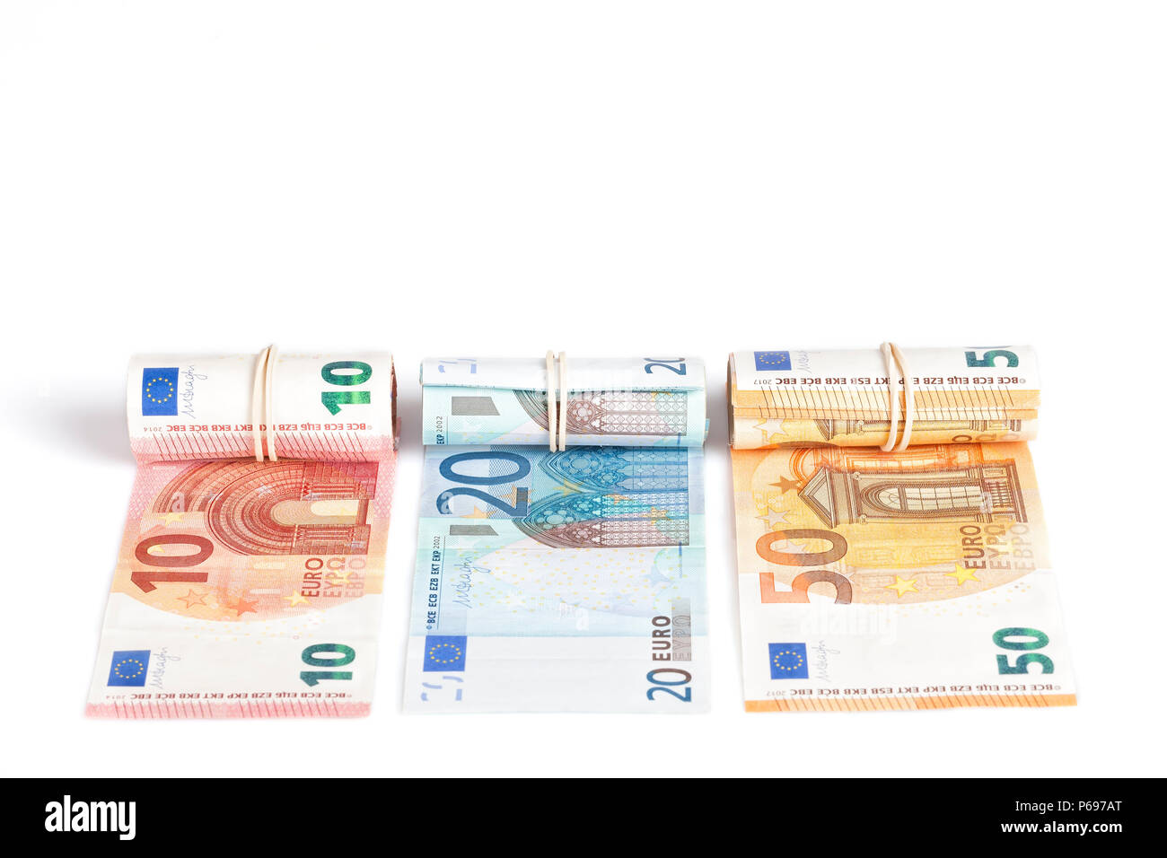 Euro bills rolled up and isolated on white background Stock Photo - Alamy