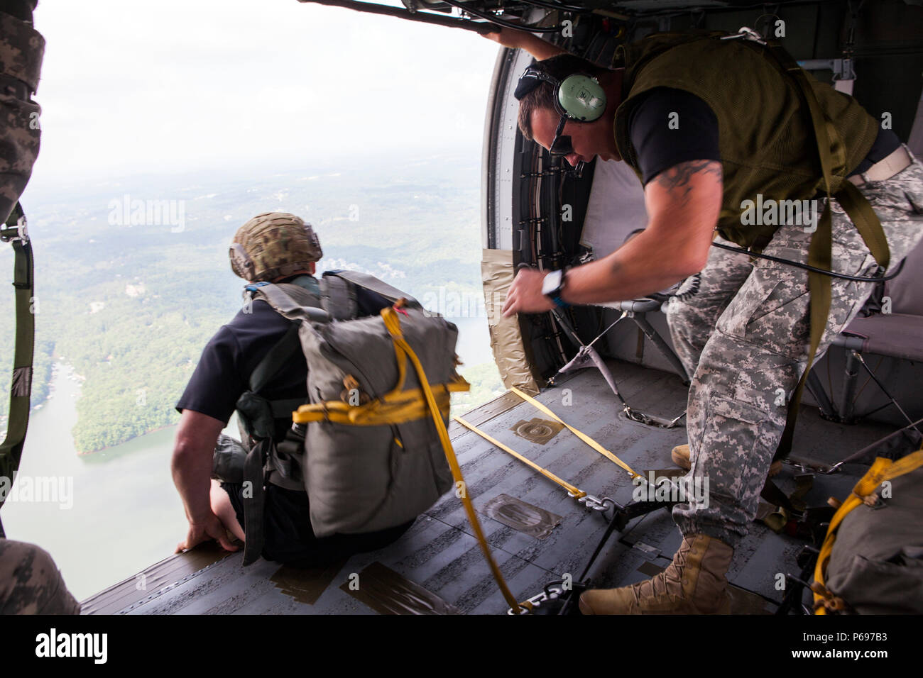 U.S. Army Rangers prepare to parachute from a UH-60 Black Hawk into ...