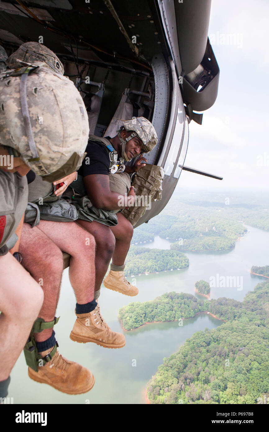 U.S. Army Rangers prepare to parachute from a UH-60 Black Hawk into ...
