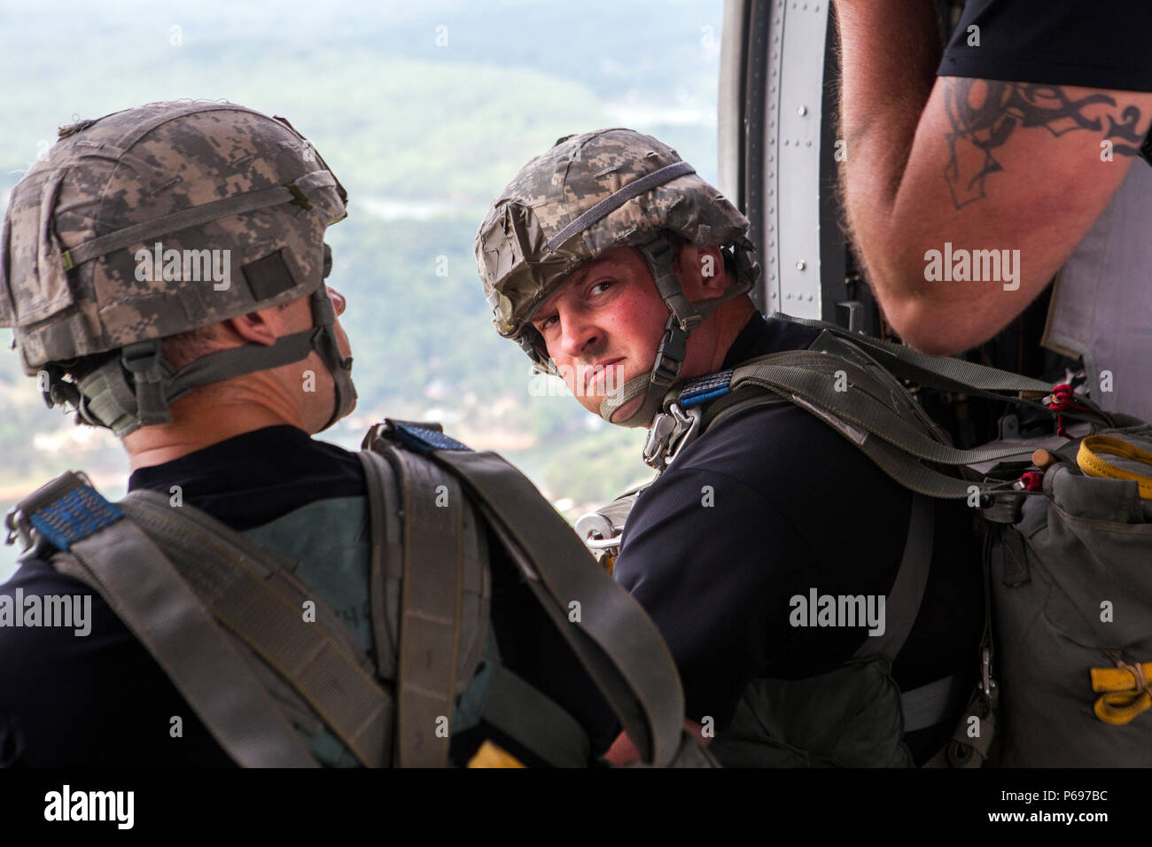 U.S. Army Rangers prepare to parachute from a UH-60 Black Hawk into ...