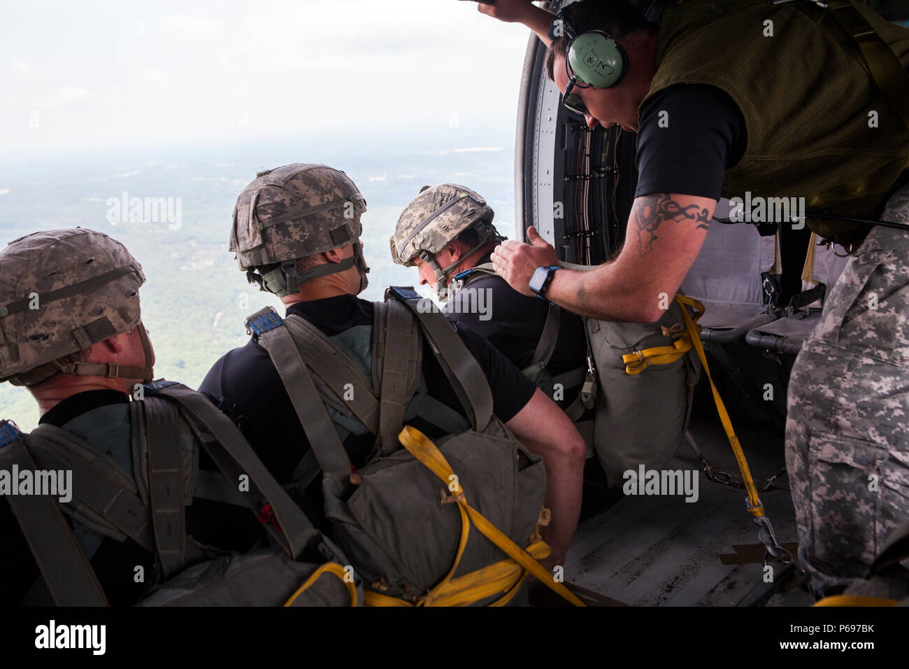 U.S. Army Rangers prepare to parachute from a UH-60 Black Hawk into ...