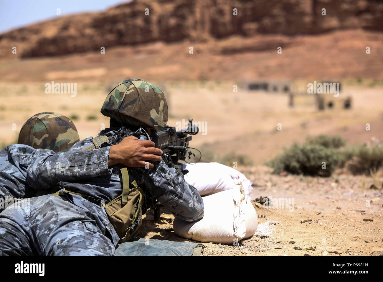 Members of the Jordanian 77th Marines Battalion engage targets with an ...