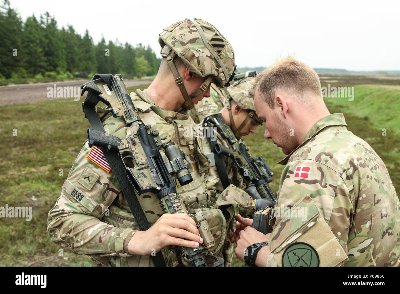 Pvt. Evan Hess (Left), an M1 armor crewman with the 3rd Battalion, 69th ...