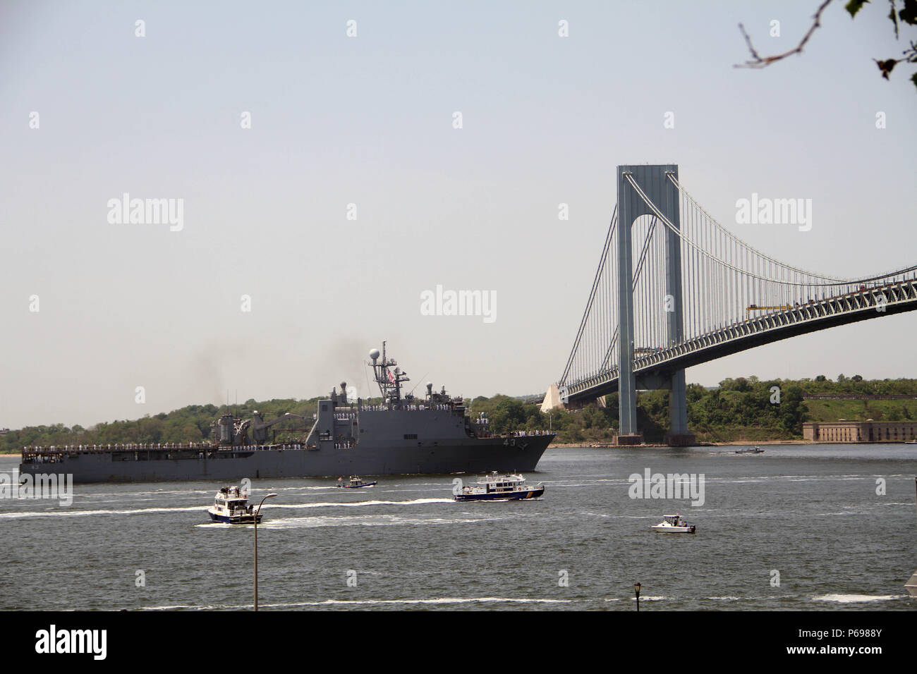 USS McHenry approaches the Verrazano Narrows Bridge during the New York ...