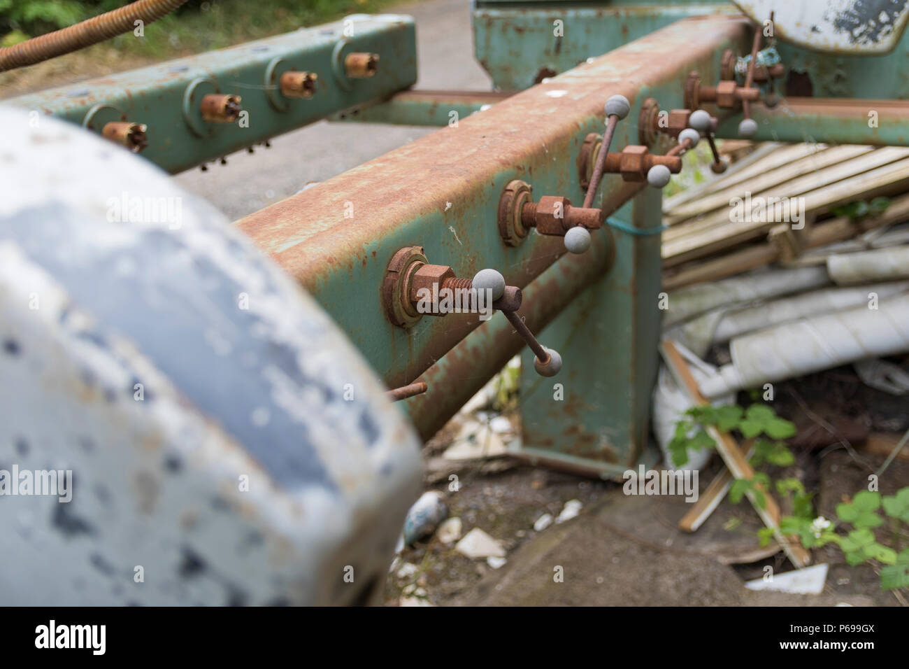 A vintage, rusty 6 head wood copy pantograph machine, abandoned outside ...