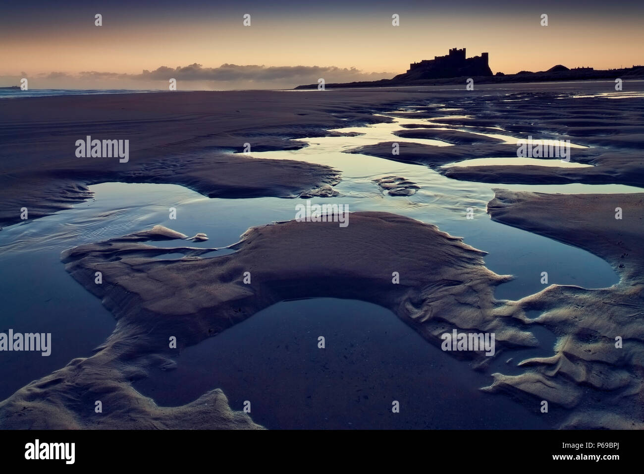 Dawn at Bamburgh Castle on the Northumbrian coast Stock Photo - Alamy