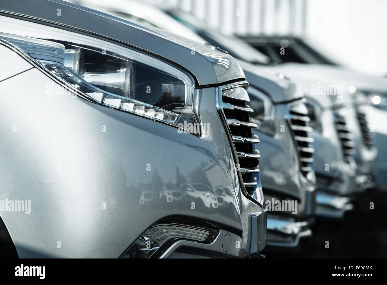 cars located row at shallow depth of field Stock Photo - Alamy