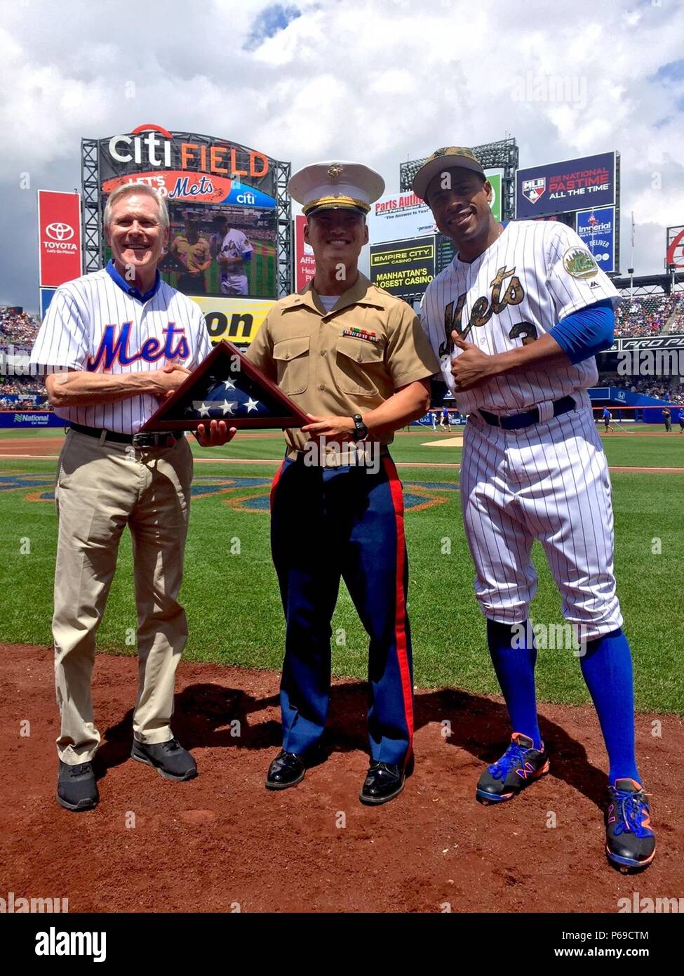 The Secretary of the Navy Ray Mabus, left, and Curtis Granderson, an ...