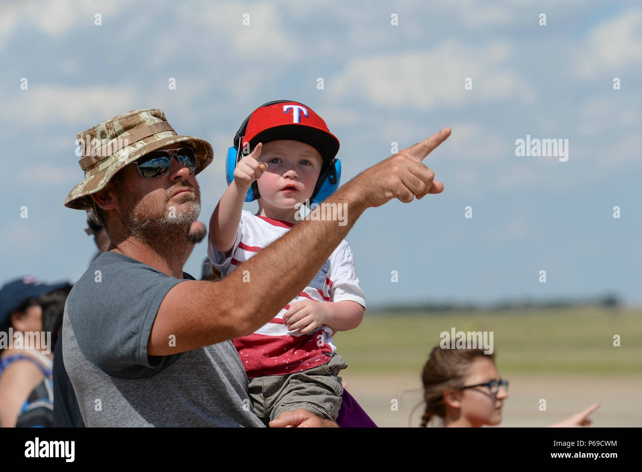 A child and his father watch the Air Commandos on the High Plains air ...