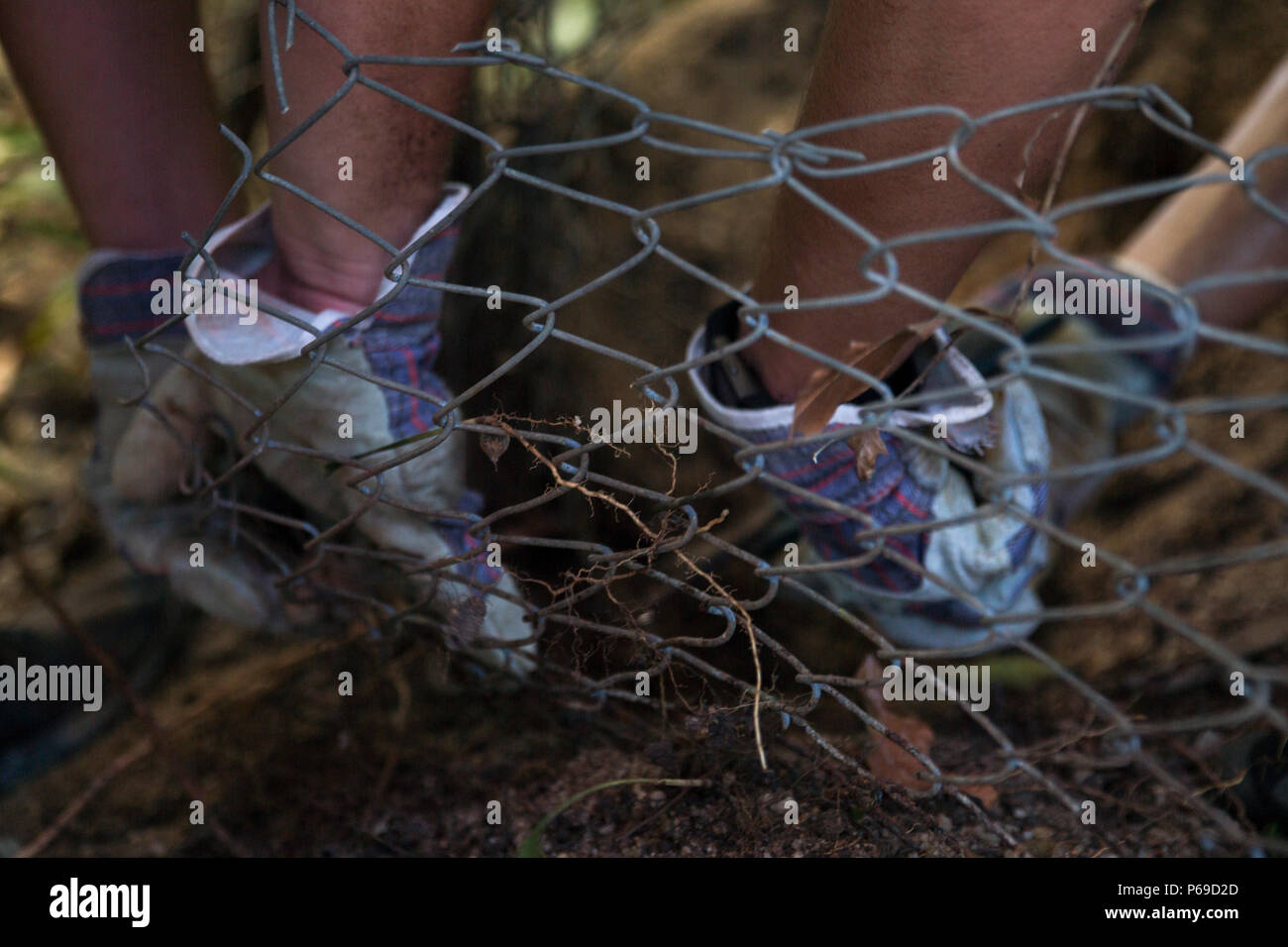 U.S. Marines remove an old fence at Millner Preschool, Northern ...