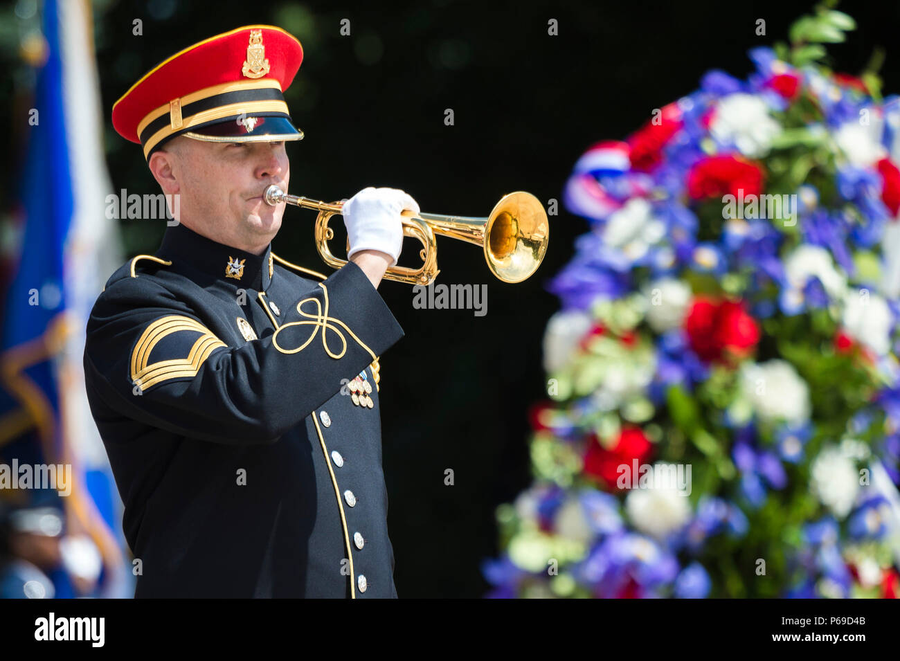 A U.S. Army Band member plays TAPS during a Memorial Day wreath-laying ...