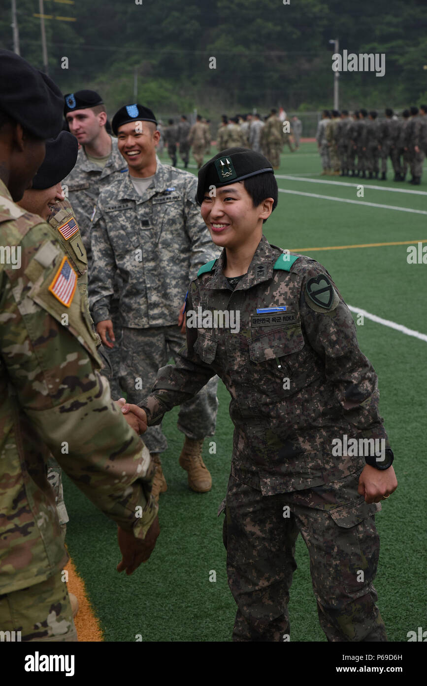 Soldiers congratulate Republic of Korea Army 1st Lt. Ji Eun Jeong, a ...