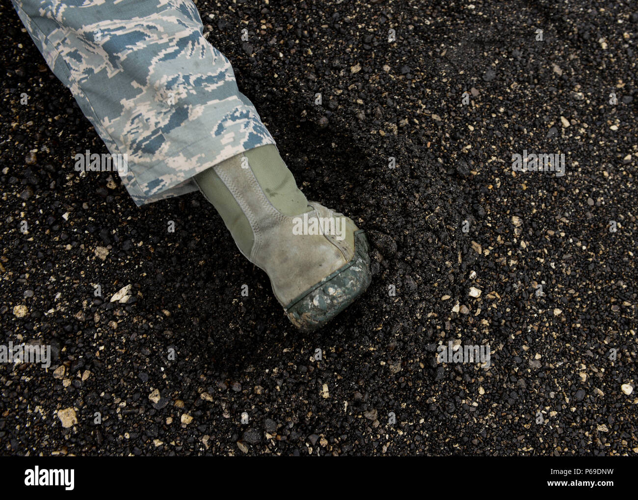 An Airman assigned to the 31st Security Forces Squadron pushes a Humvee ...