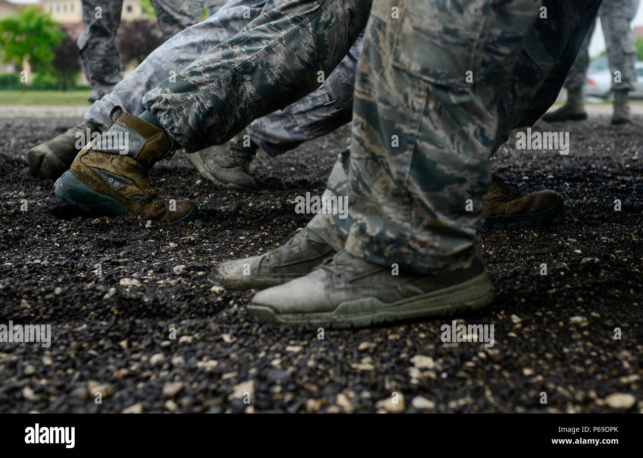 Airmen assigned to the 31st Security Forces Squadron, push a Humvee ...